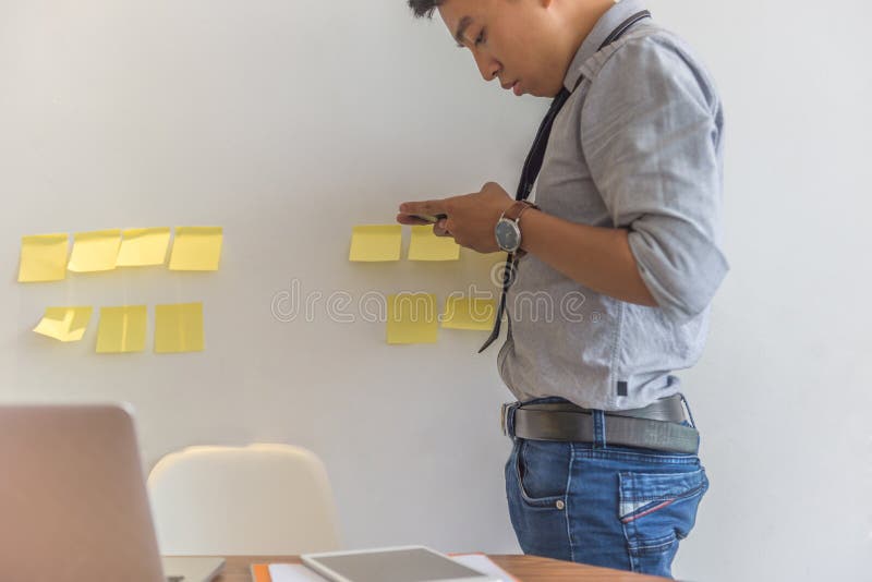 Young Businessman Using Phone To Text Message Stock Photo - Image of ...
