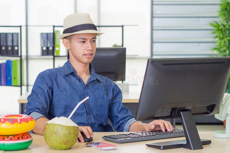 Young Businessman Wearing a Hat and Working in the Office. Prepare for ...