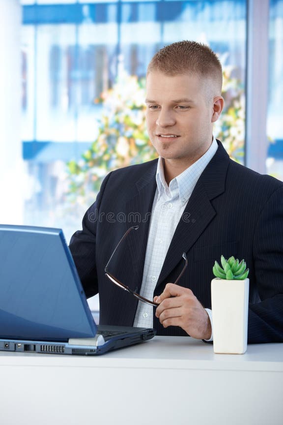 Young businessman at work stock image. Image of computer - 20531625