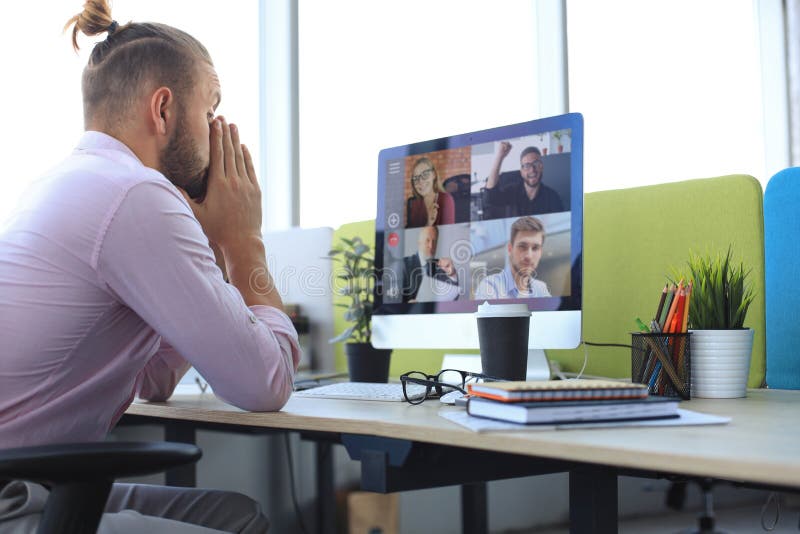 Young Businessman Working on Computer, Doing Video Conference with ...