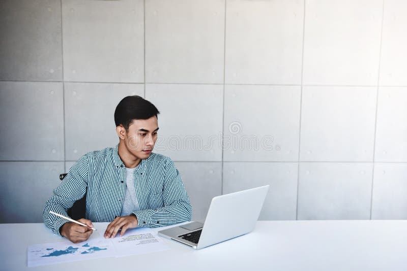 Young Businessman Working on Computer Laptop in Office Stock Photo ...