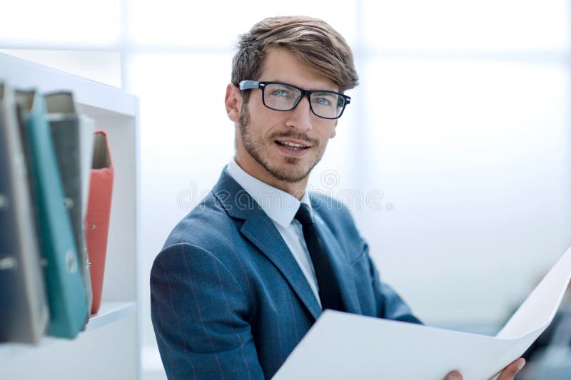Handsome Smiling Businessman Looking at Documents Stock Photo - Image ...