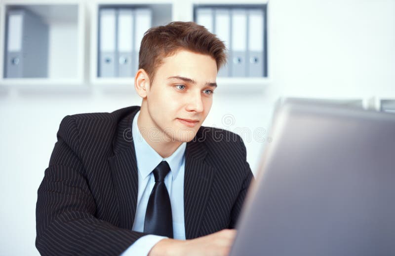 Young Businessman Working on Laptop in Office Stock Image - Image of ...