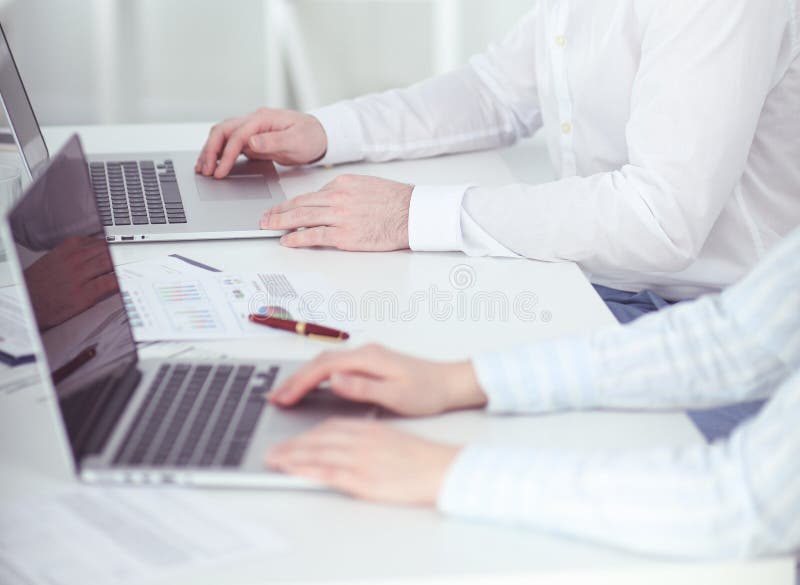 Young Businessman Working in Office, Sitting at Desk, Looking at Laptop ...