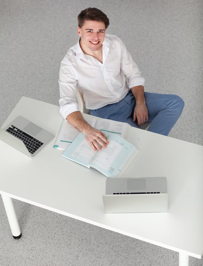 Young Businessman Working in Office, Sitting Near Stock Photo - Image ...