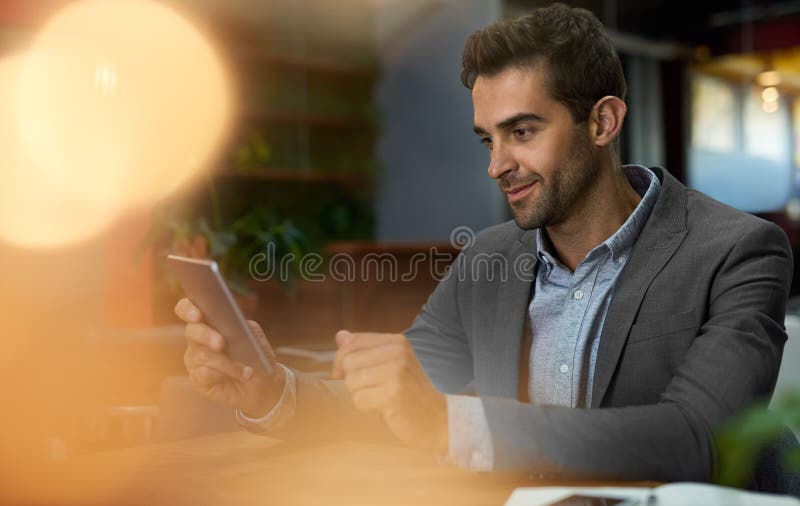 Young Businessman Working on a Tablet in a Quiet Office Stock Photo ...
