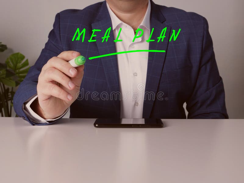 Young Businessman Writing MEAL PLAN with Marker in the Office Stock ...