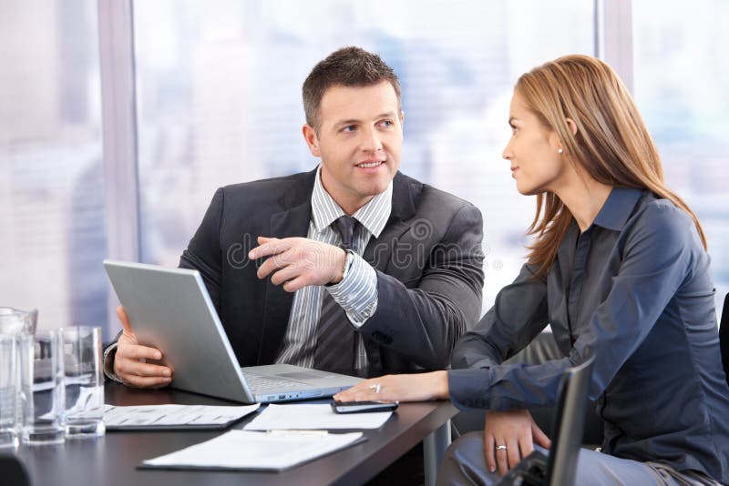 Young Businesspeople Negotiating Stock Photo - Image of attractive ...
