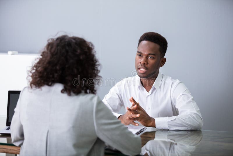 Young Businesspeople Sitting at Interview Stock Photo - Image of hire ...