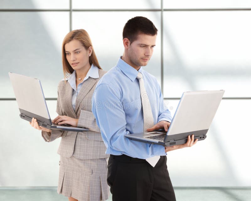Young Businesspeople Working in Office Lobby Stock Image - Image of ...