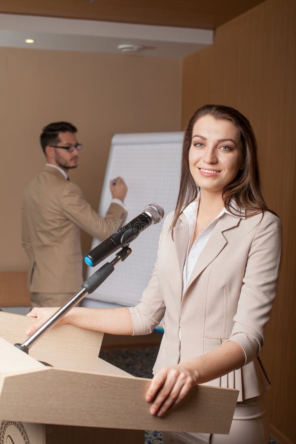 Young Businesswoman and Businessman Holding Presentation Stock Image ... Young Businesswoman and Businessman Holding Presentation Stock Image ...