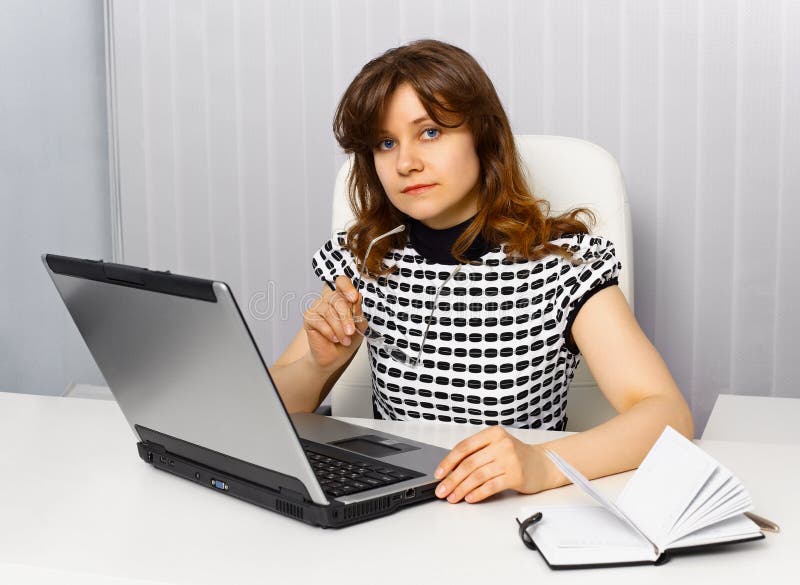 Young Woman Sitting in Office Typing on Laptop Stock Photo - Image of ...