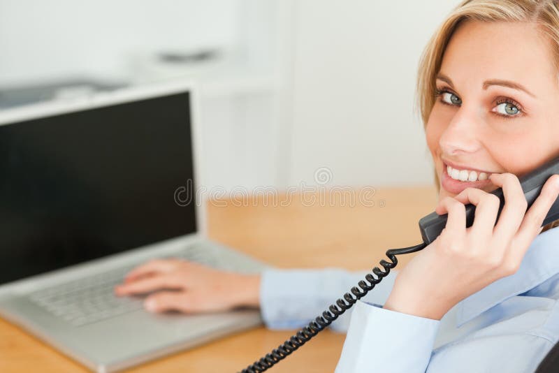 Hotel Receptionist Using Computer and Phone Stock Image - Image of ...