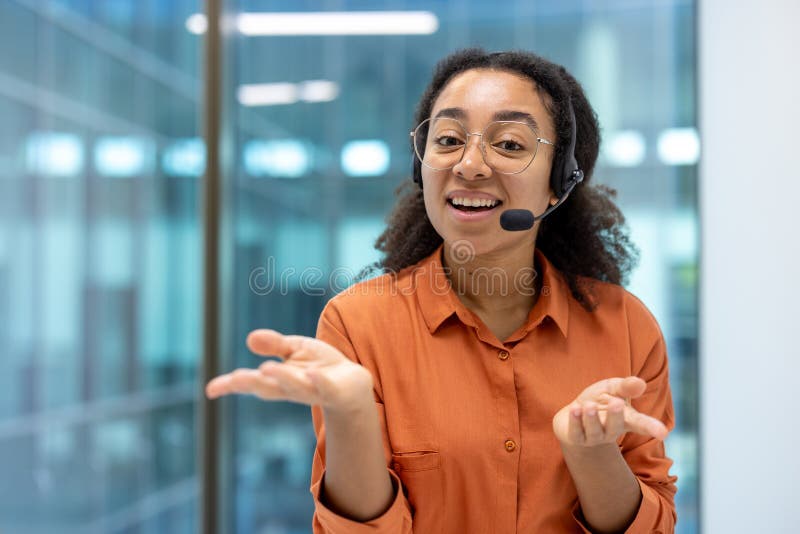 Young Businesswoman Talking with Headset in Modern Office Setting Stock ...