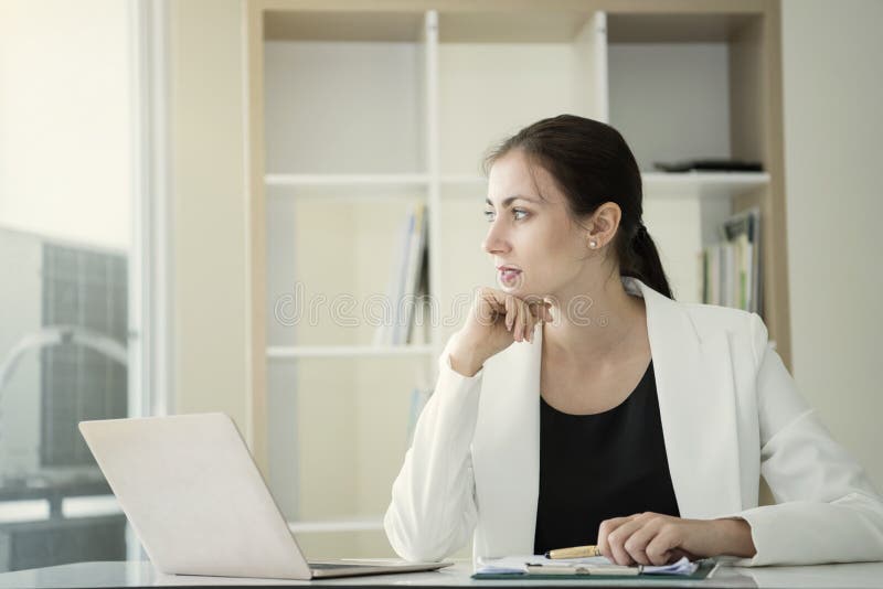 Young Businesswoman Thinking Idea for Work at Office Stock Image ...