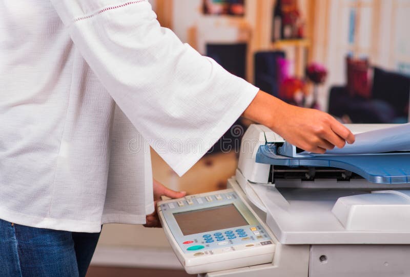 Young Businesswoman Using Copy Machine at the Office Stock Image ...