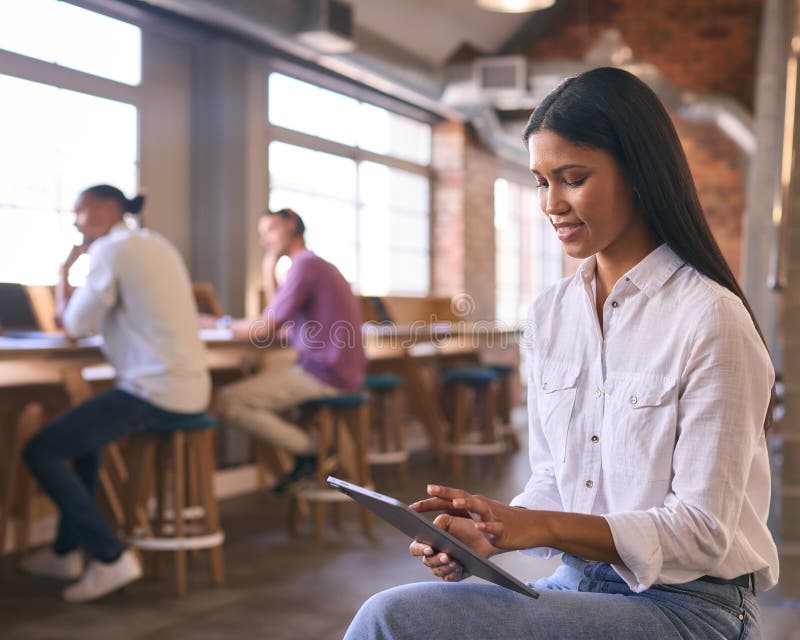 Young Businesswoman Using Digital Tablet Working in Modern Open Plan ...