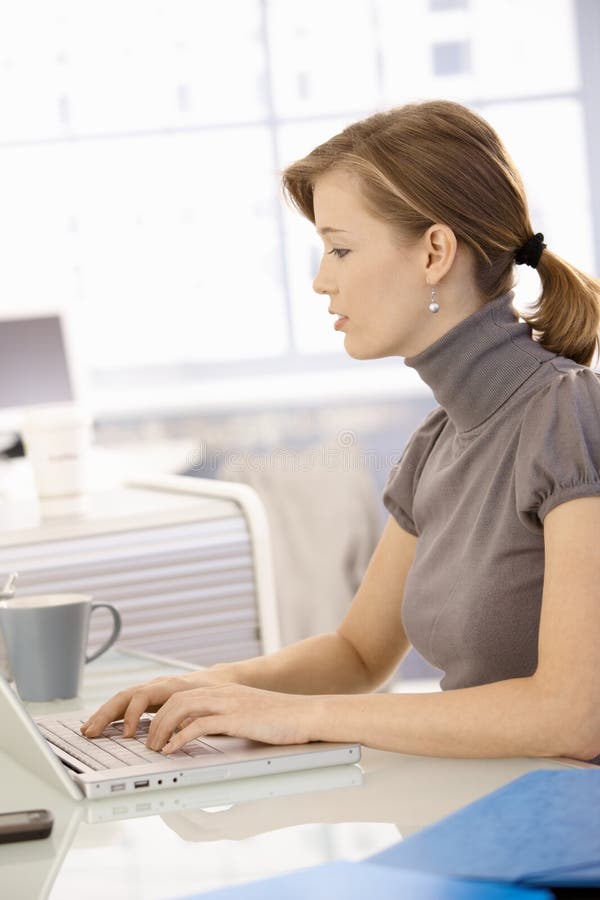 Young Businesswoman Using Laptop Stock Image - Image of look, face ...