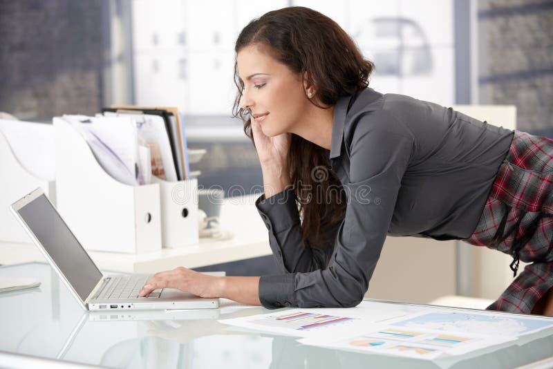 Young Businesswoman Using Laptop in Office Stock Image - Image of ...