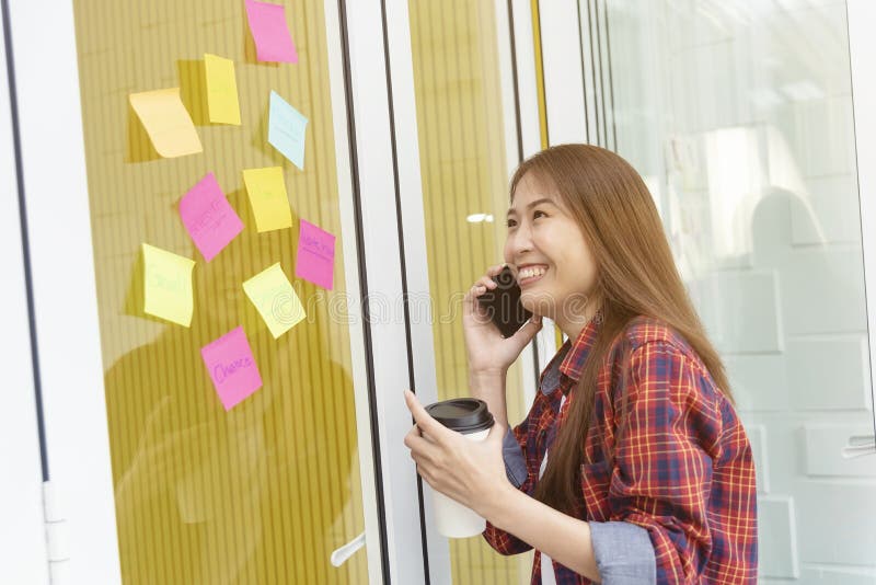 Young Businesswoman Using Mobile in Office. Modern Wireless Connection ...