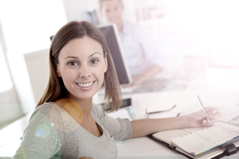 Young Businesswoman Writing Down Notes Stock Photo - Image of employee ...