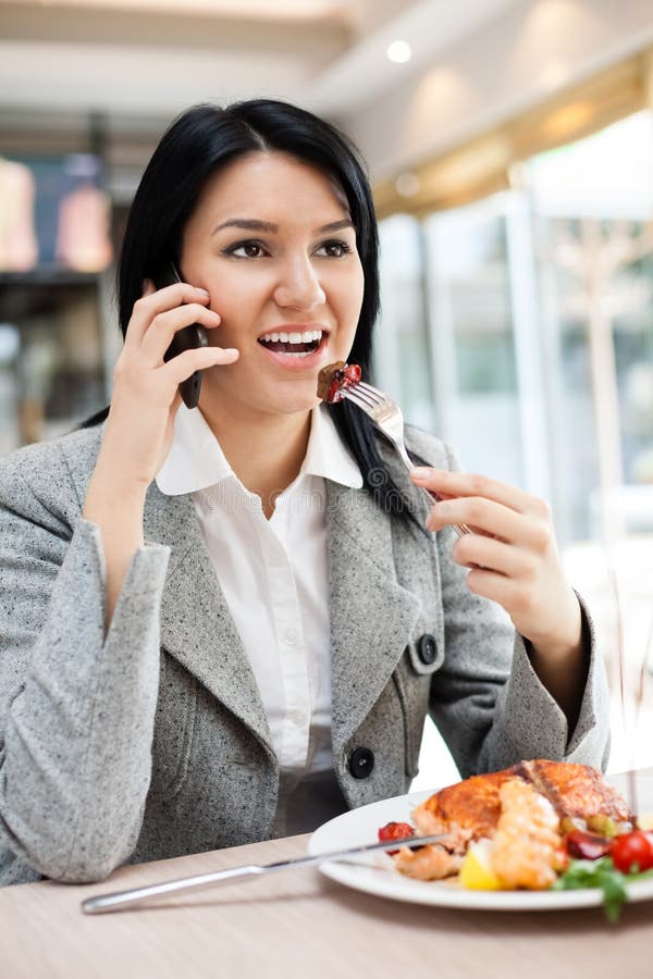 Young Businesswomen Eating in Restaurant Stock Photo - Image of ...