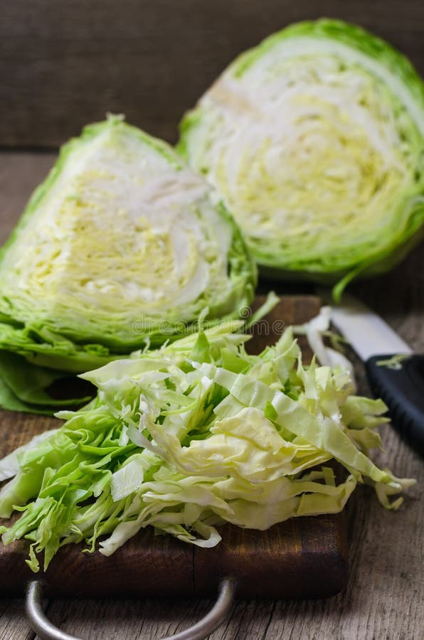 Young Cabbage on a Wooden Cutting Board Stock Photo - Image of head ...