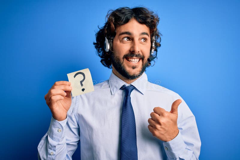Young Call Center Agent Man with Beard Working Using Headset Holding ...