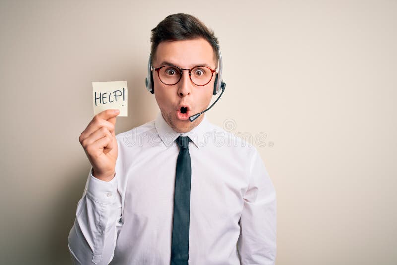 Young Call Center Operator Man Wearing Headset Holding Paper Note with ...
