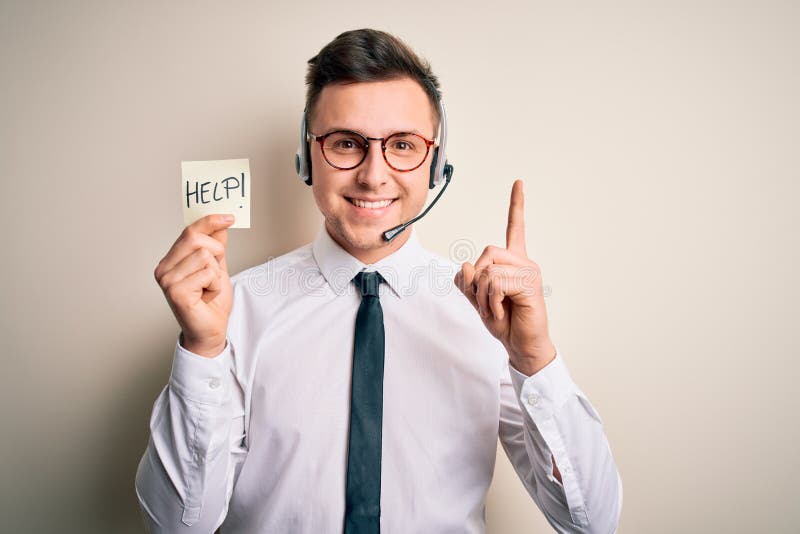Young Call Center Operator Man Wearing Headset Holding Paper Note with ...