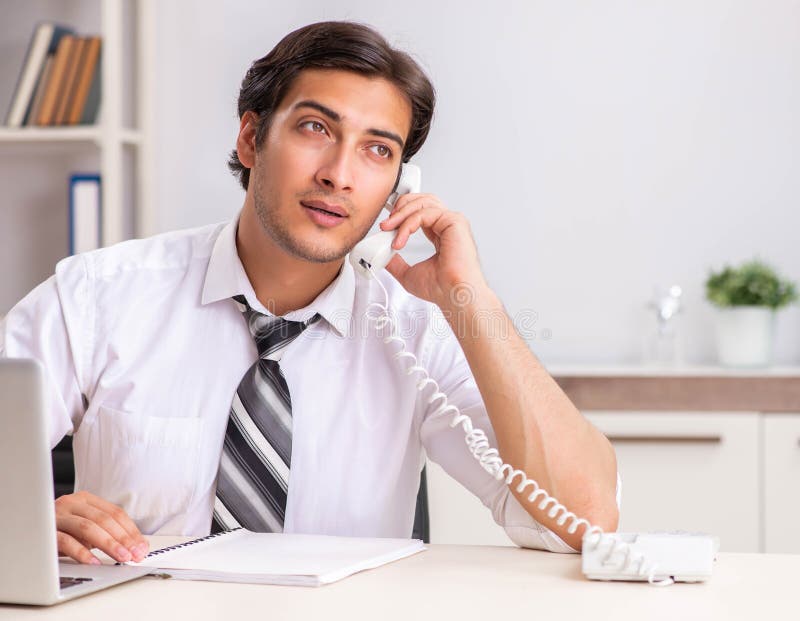Young Call Center Operator Speaking on Phone Stock Image - Image of ...
