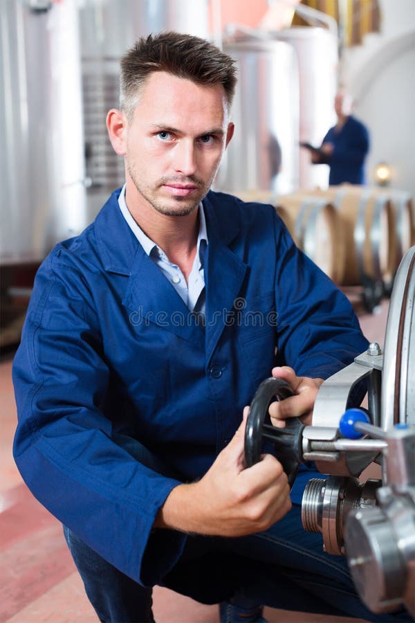 Young Calm Man Machinery Operator Working in Winery Stock Image - Image ...