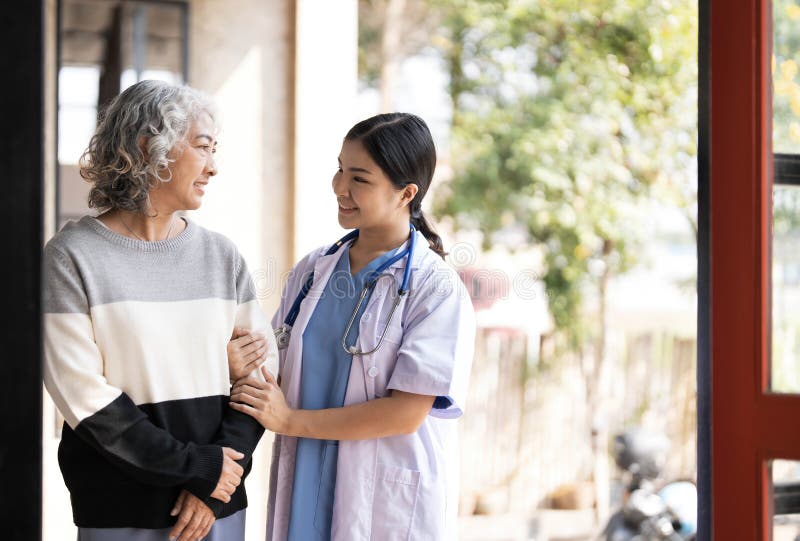 Young Caregiver Helping Senior Woman Walking Nurse Assisting Her Old