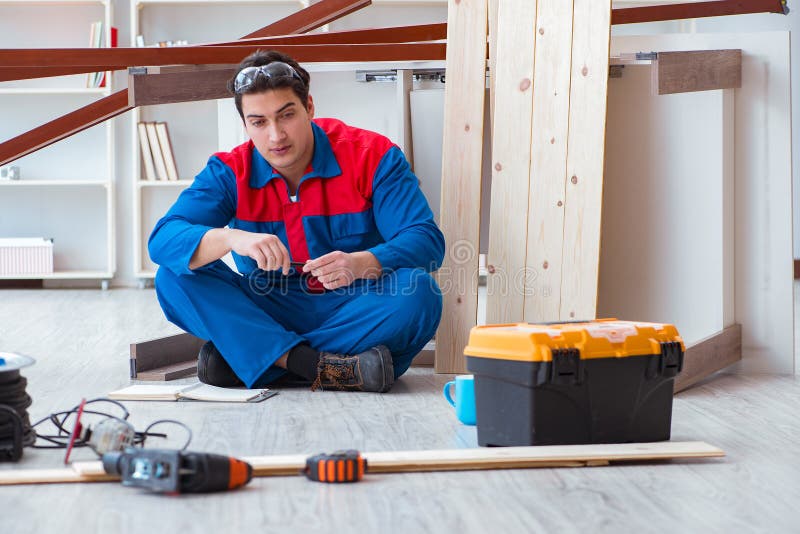 Young Carpenter with Notebook Writing Planning at Construction R Stock ...