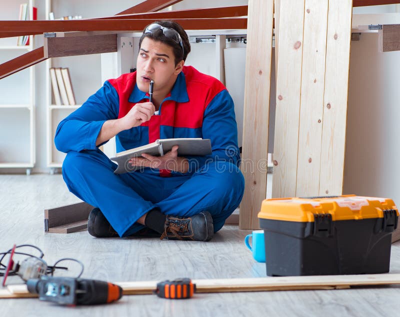 Young Carpenter with Notebook Writing Planning at Construction R Stock ...