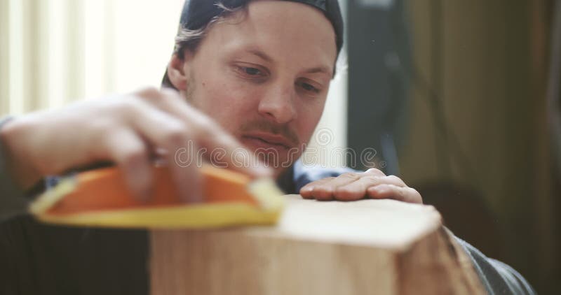 Young Carpenter Sanding Wood in Workshop Stock Video - Video of ...