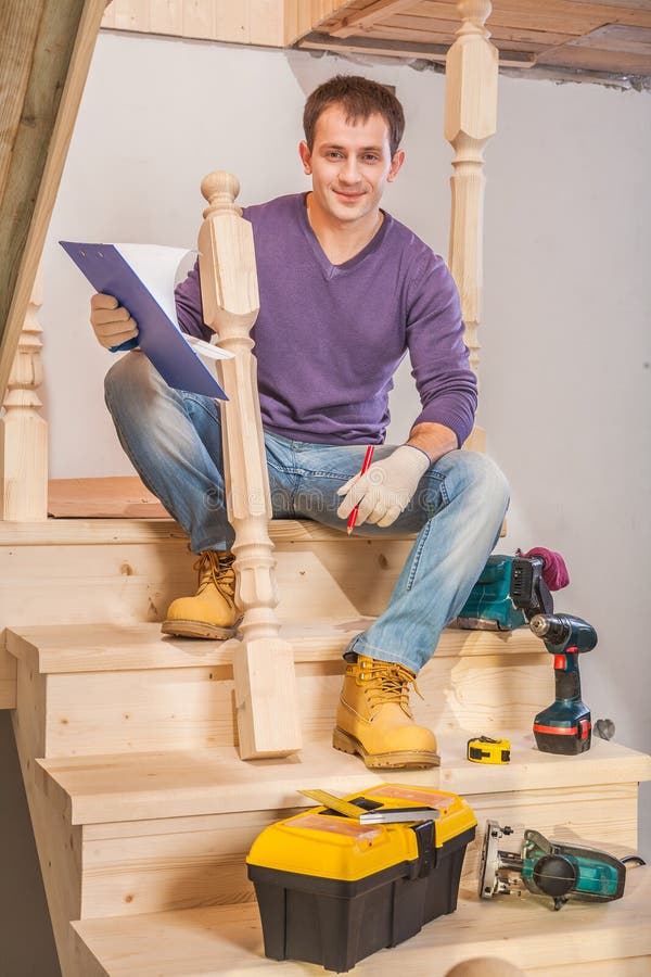 Young Carpenter Sitting on Step of of Ladder with Tools Stock Photo ...
