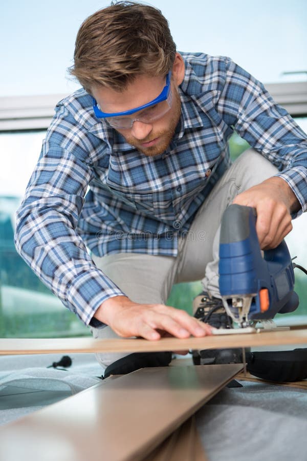 Young Carpenter Using Band-saw in Building Stock Photo - Image of hand ...