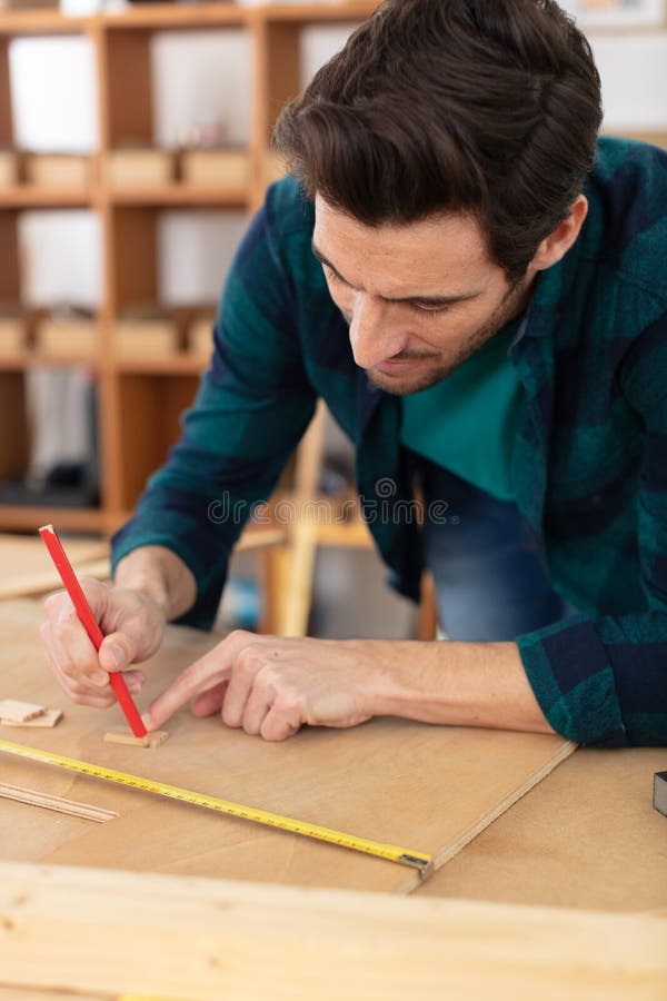 Young Carpenter Writing Something on Plan Stock Image - Image of plan ...