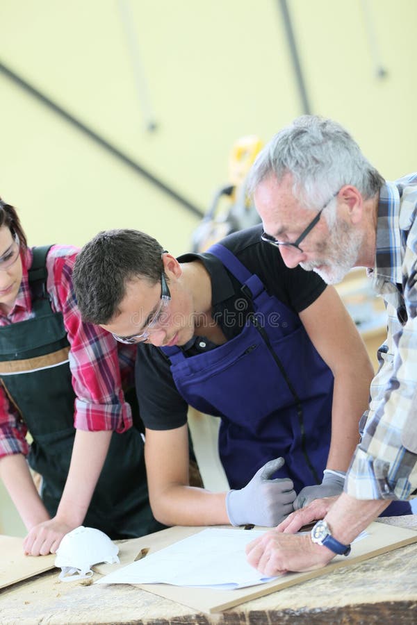 Young Carpenters Learning from Instructor Stock Image - Image of girl ...