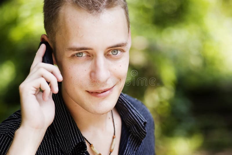 Young casual man on phone stock image. Image of adult - 16489085