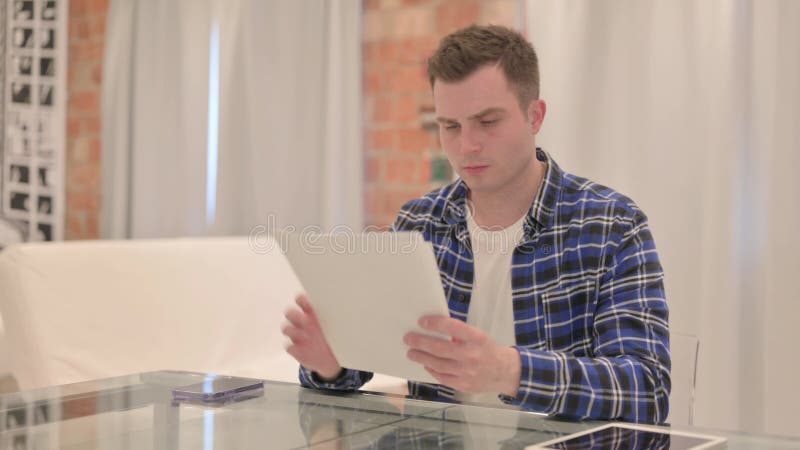 Young Casual Man Reading Documents at Work, Paperwork Stock Footage ...