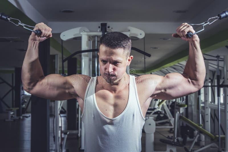 Man Doing Cable Fly Exercise in Gym Stock Image - Image of muscle ...