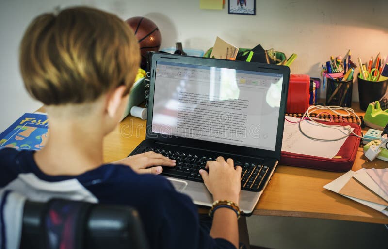 Young Caucasian Boy Doing Homework with Computer Laptop Stock Image ...