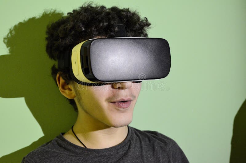 A Young Caucasian Boy Wears the VR 360 Viewer in His Room Stock Image ...