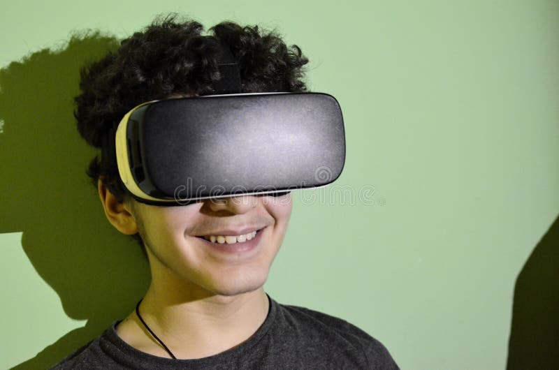 A Young Caucasian Boy Wears the VR 360 Viewer in His Room Stock Image ...