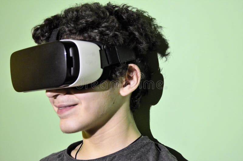 A Young Caucasian Boy Wears the VR 360 Viewer in His Room Stock Photo ...
