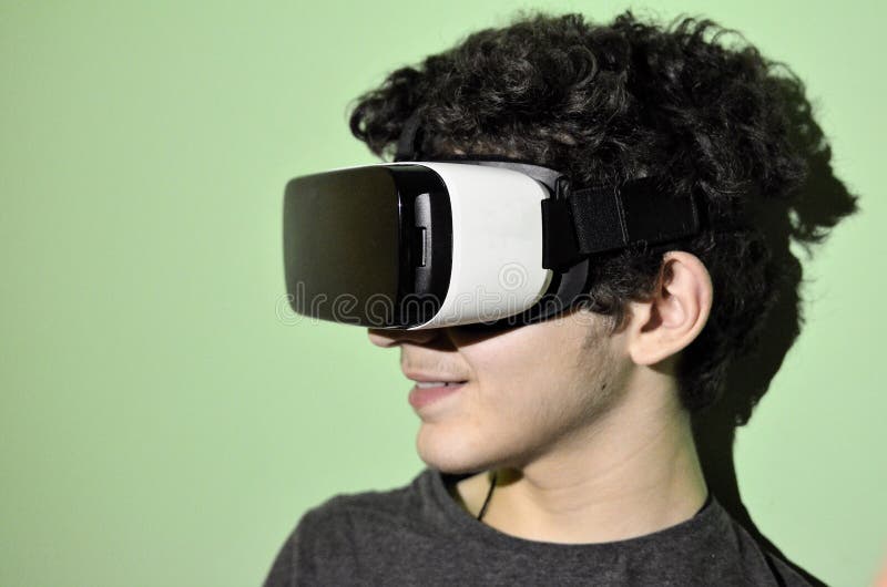 A Young Caucasian Boy Wears the VR 360 Viewer in His Room Stock Image ...