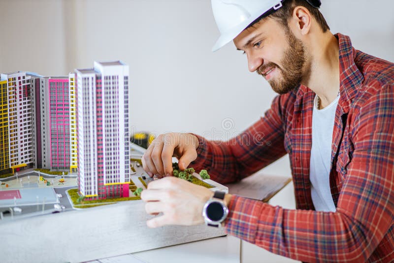 Young Builder Assemble Complex Building Model, Construction Stock Photo ...