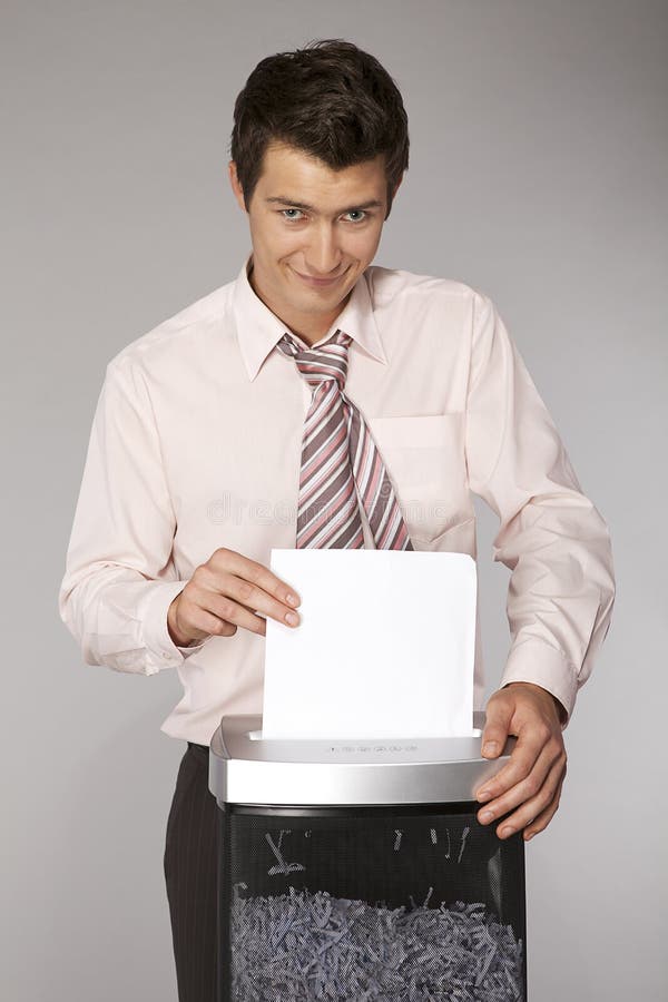 Young Caucasian Businessman Shredding Documents Stock Photo - Image of ...